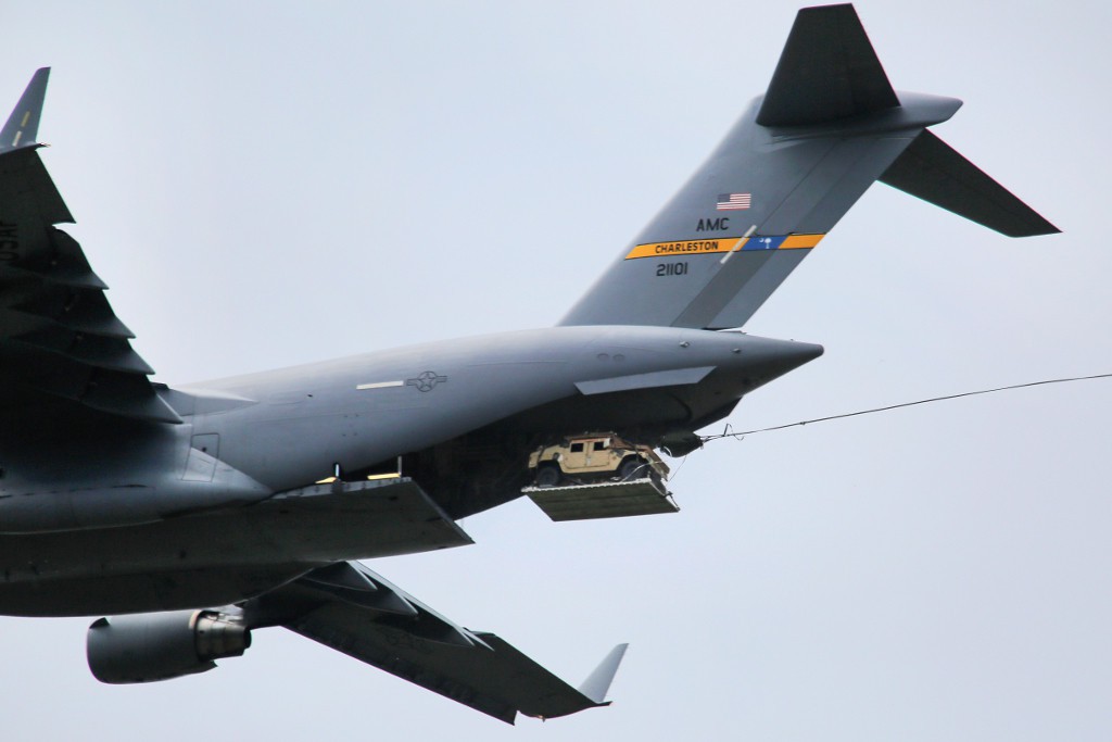 Now that's a delivery: dropping Humvees by parachute from transport planes