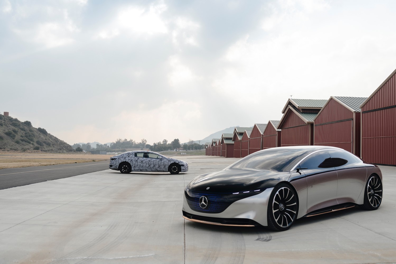 The New Mercedes EQS is seen alongside the Vision EQS