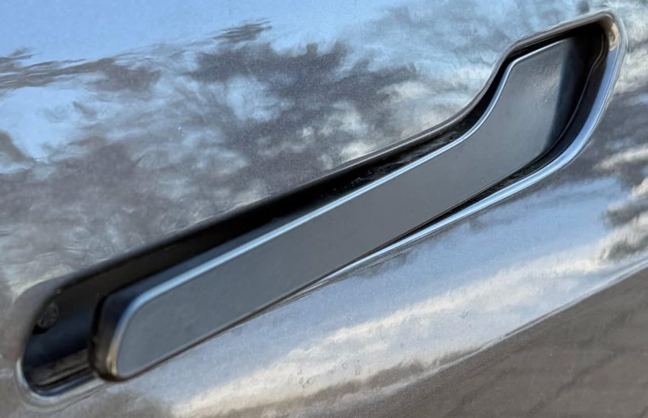 Tesla is working on a new door opening system that combines mechanical ...