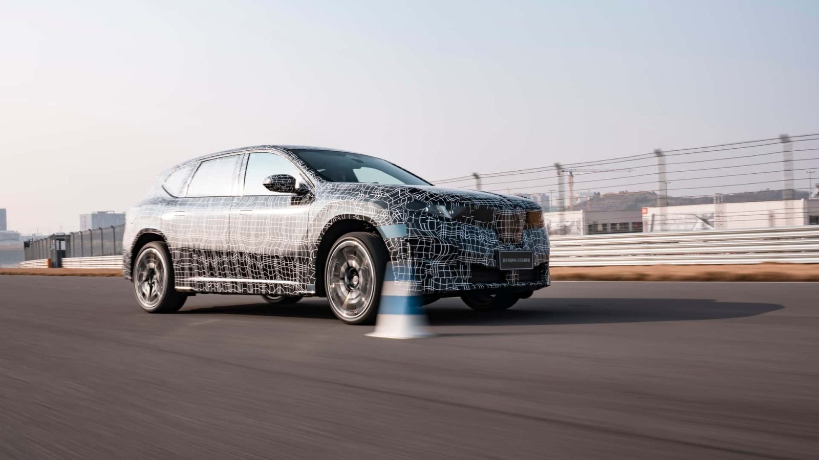 BMW shows a camouflaged version of the long-wheelbase iX3 destined for ...